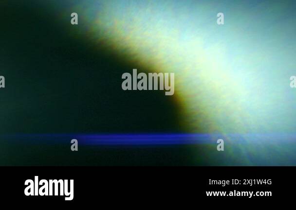 A vibrant lens flare tracing a smooth arc path across a dark background ...