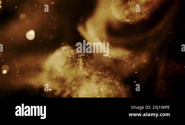 A multitude of small, bright particles burst outward against a dark ...