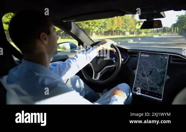 Successful businessman riding on electrical vehicle at city. Male ...