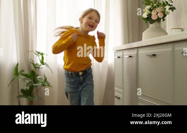 Little happy girl dancing singing daughter child joyful fun kid ...