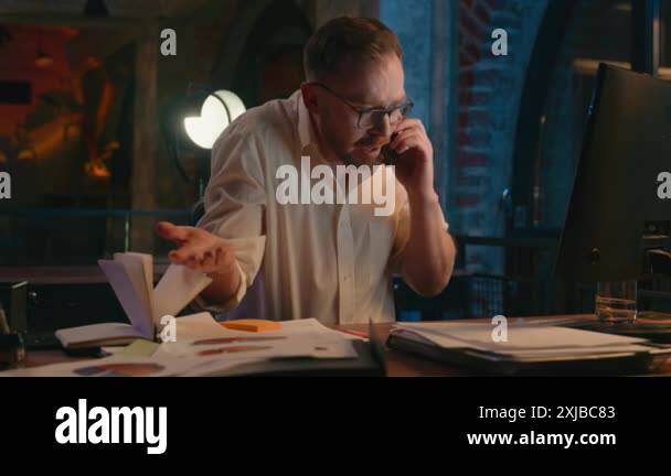 Stressed tired angry aggressive furious business man at night office ...