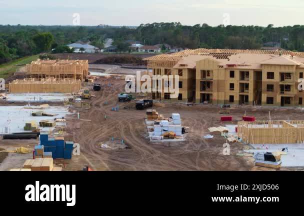 Wooden apartment buildings under construction in new developing ...