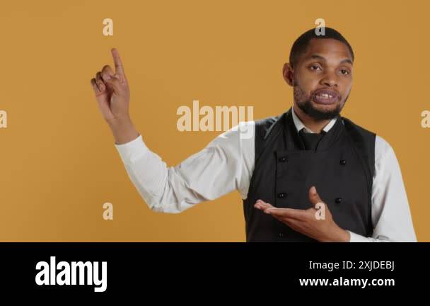 Friendly restaurant staff indicating direction to left or right sides ...