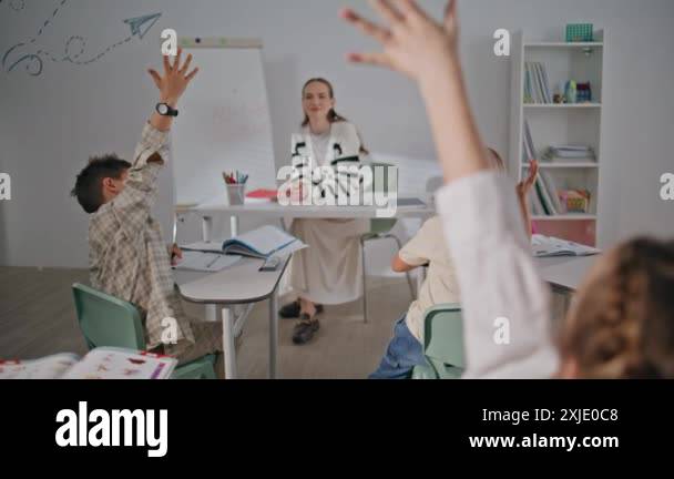 Kids raising hands classroom back view Stock Videos & Footage - HD and ...