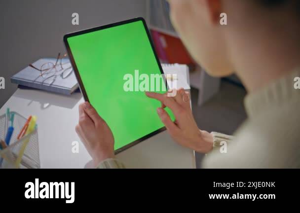 Chromakey tablet teacher swiping display browsing internet at home ...