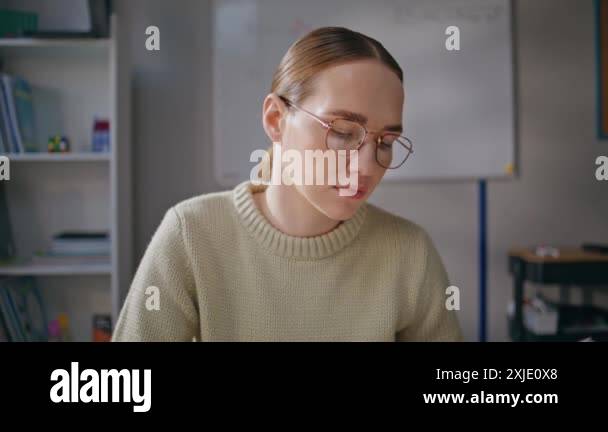 Smart woman working school closeup. Young teacher lady in glasses ...