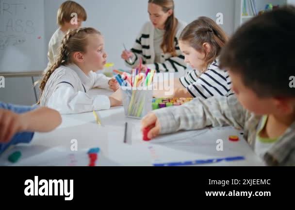 Talented kids creating artwork together in studio closeup. Young ...