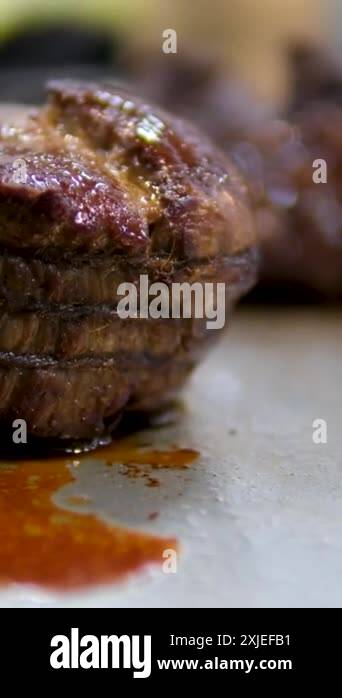 Process of preparing beef tenderloin steak. Close-up of roasting juicy ...