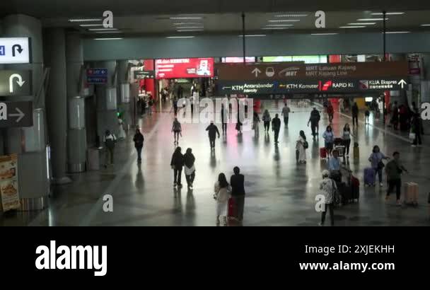 Busy metro station in Kuala Lumpur, Malaysia. Traffic on a platform in ...