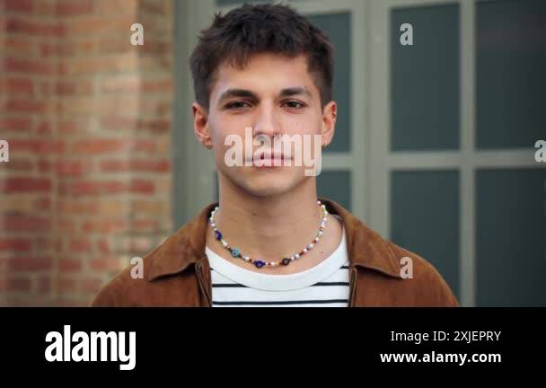 Young adult guy at academy. Individual portrait of a serious schoolboy ...