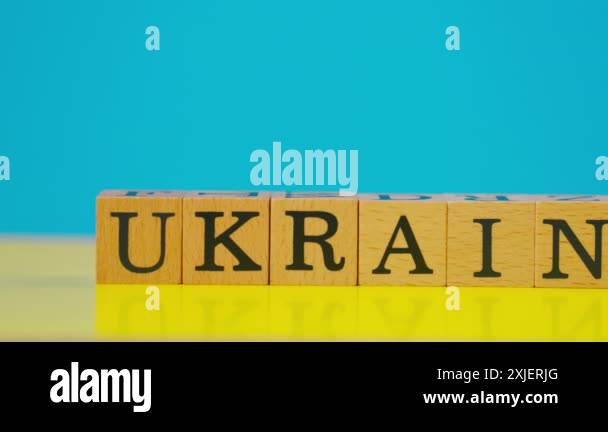 ukraine flag blue and yellow warm background with shadows woman hand ...