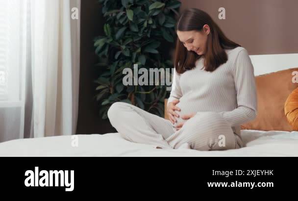 Expecting Joy concept happy smiley beautiful pregnant woman with a ...