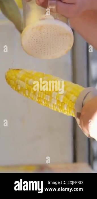 Sprinkling Salt On Sweet Corn. Appetizing Healthy Natural Nutrition ...