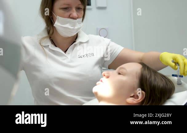 Dentist filling. female dentist examining young girl patients teeth at ...