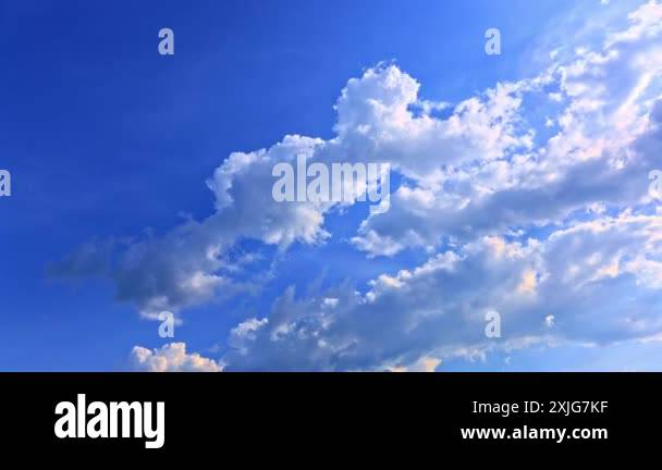 Blue sky white clouds. Puffy fluffy white clouds. Cumulus cloud cloudscape timelapse. Summer ...