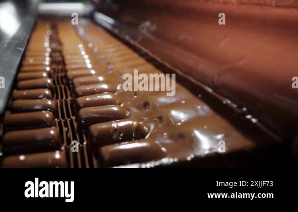 Conveyor belt in a chocolate factory. Candy production. Chocolate ...