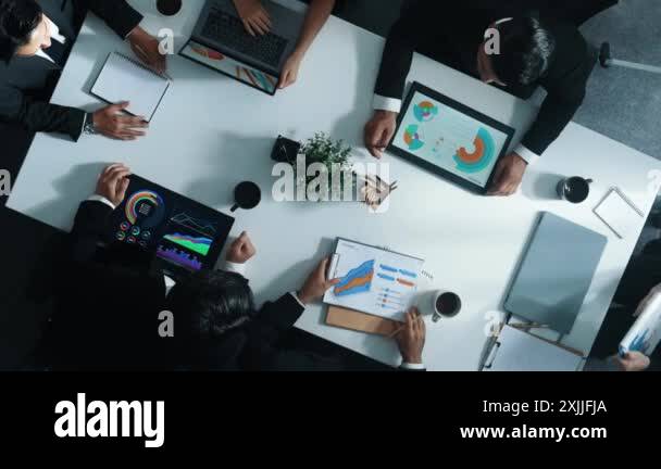 Top view of executive manager present increasing graph while team clap ...