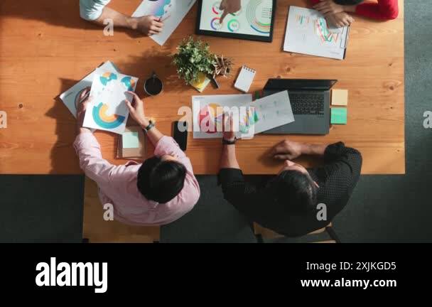 Top down view of business woman explain and present financial chart ...