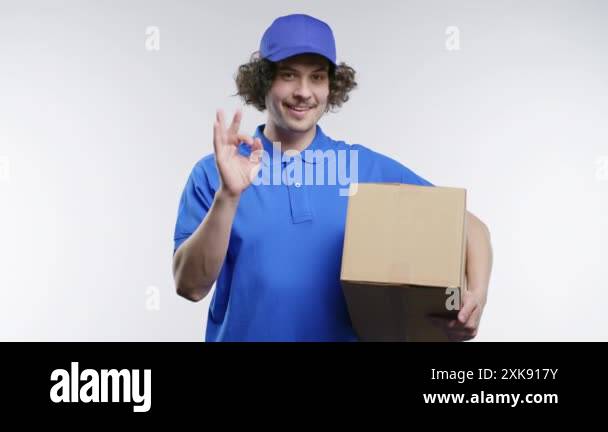 Positive postal courier man with hands sign OK, okay. Happy postman in ...