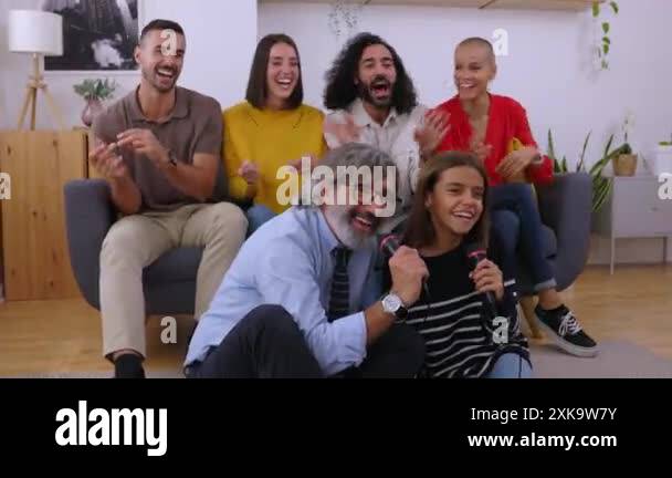 Close-up front view of multi-generational family having fun playing ...