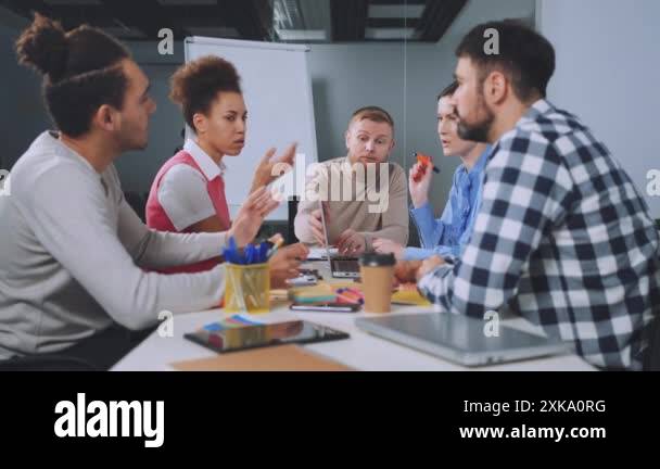 Team members argue, each defending their point of view during intense ...