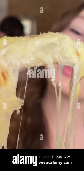 slice of hot Italian pizza with stretching cheese. Pizza four cheeses ...