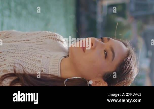 Relaxed mexican model posing at sunshine quay portrait. Carefree woman looking camera enjoying ...