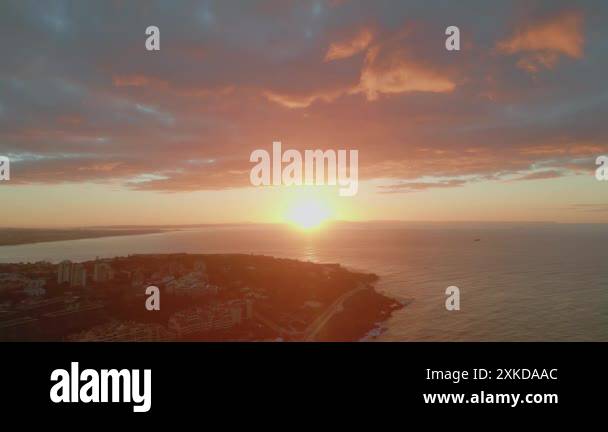 Golden sun sit down on marine horizon aerial view. Amazing golden ...