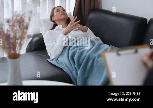 Young female patient lying on crouch release emotion from traumatic ...