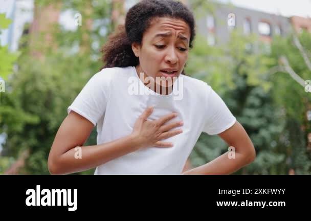 Woman touching chest Stock Videos & Footage - HD and 4K Video Clips - Alamy