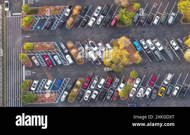 Large parking lot with many parked cars. Big carpark at supercenter ...