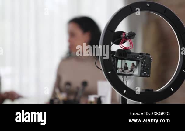 Rear view camera screen recording two women influencer shoot live ...