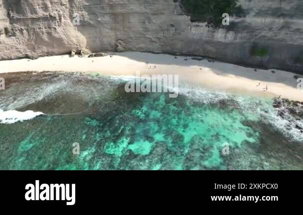 Man takes photo of woman on a beautiful tropical island beach. Drones ...