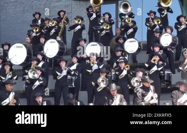 Calgary, Alberta, Canada. Jul 17, 2024. A marching band, clad in black ...