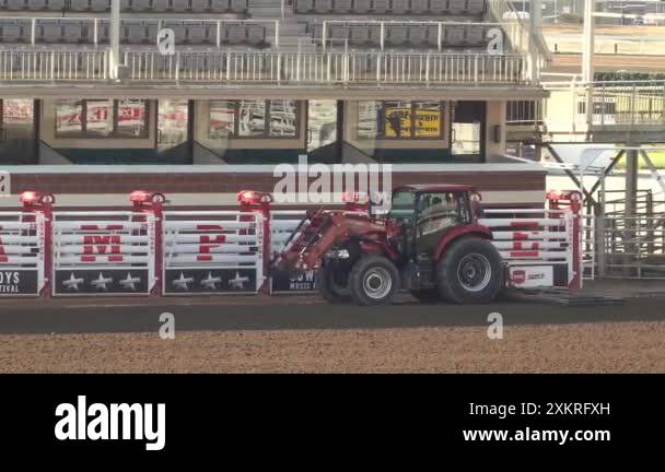 Calgary, Alberta, Canada. Jul 14, 2024. A tractor prepares the arena ...