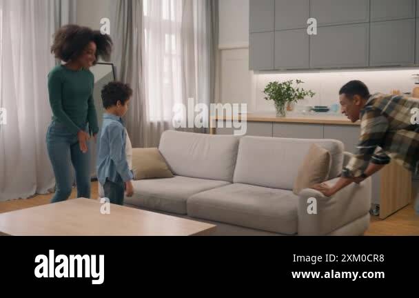 Happy excited African American family relocation woman female mom ...