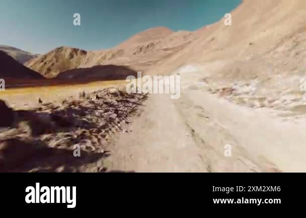 Fast motion hyper lapse biking curvy turning gravel bumpy road section ...