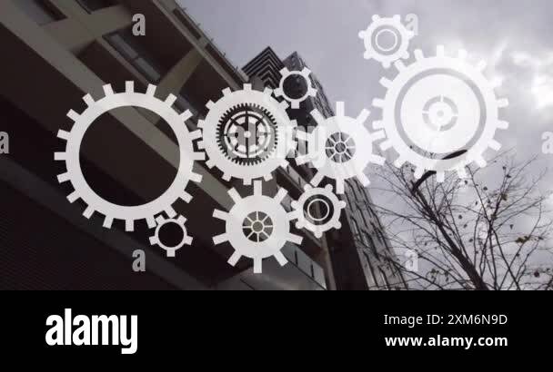 Rotating gears animation overlay on modern building exterior ...