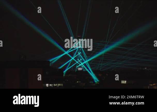 Paris, France - July 25, 2025: Distant view of Eiffel tower light show ...