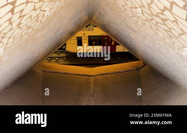 Subway train seen through modern geometric architecture. The image ...