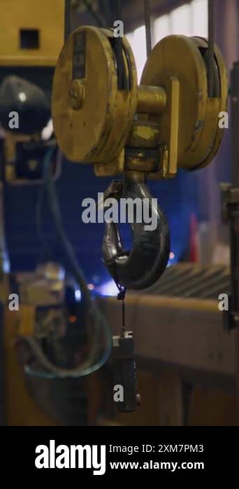 No people vertical shot of large steel hook of industrial rope hoist ...