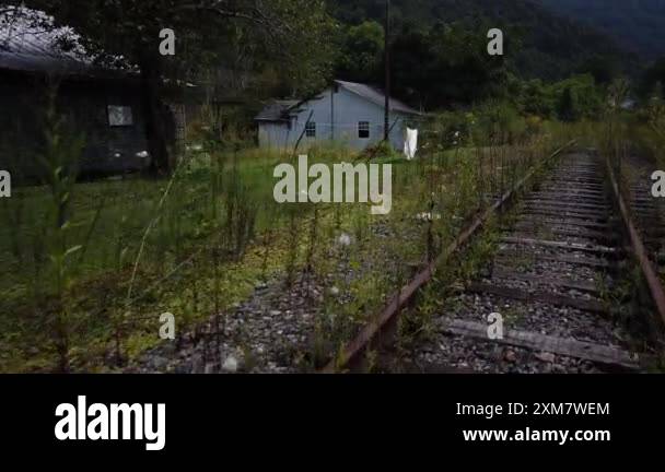 Houses and streets in the abandoned coal mining town with a railroad ...