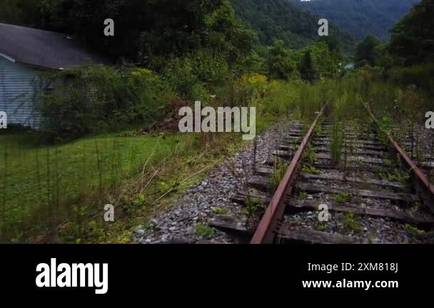 Houses and streets in the abandoned coal mining town with a railroad ...