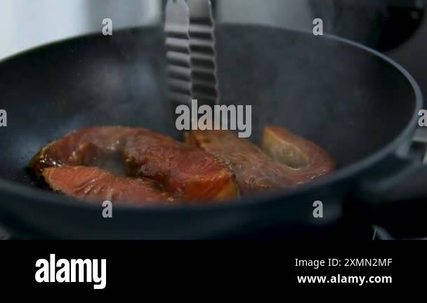 Step by step. grilling fillet salmon with asparagus, tomato, lemon. A ...
