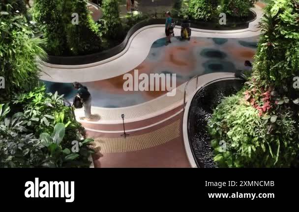 Singapore- 7 May 2024: Dreamscape garden inside Changi Airport Terminal ...