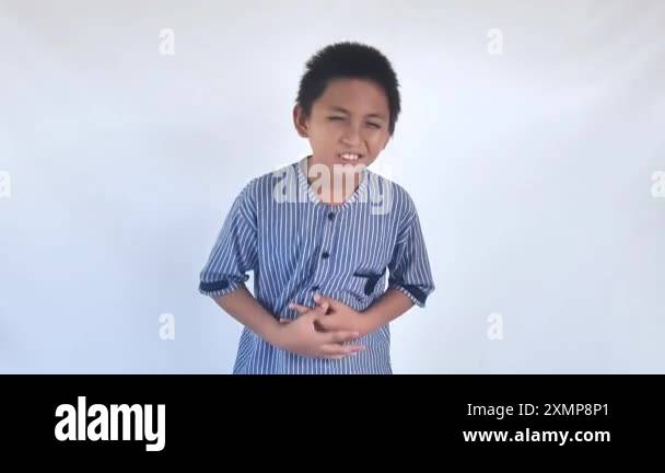 abdominal pain in a child. poisoning in children. the boy holds his ...