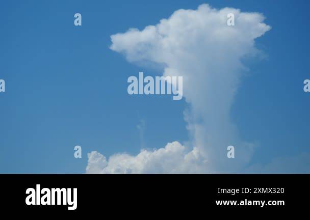 Beautiful white clouds in sunny blue sky. Volumetric light effect ...