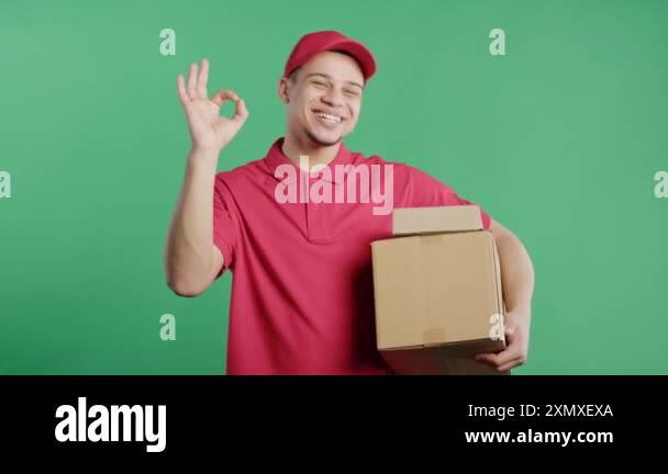 Positive postal courier man with hands sign OK, okay. Happy postman in ...