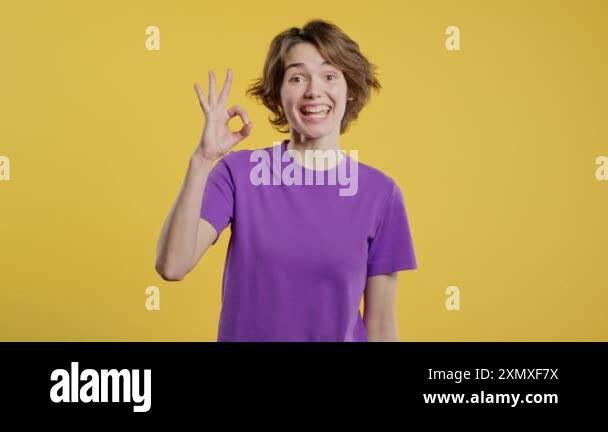 Pretty woman makes hand sign okay, ok gesture. Happy girl, correct ...