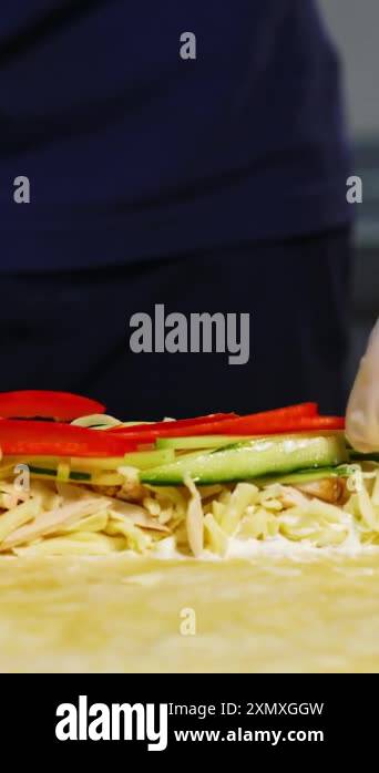 Cooking meal in fast food restaurant. Professional cook in white gloves ...